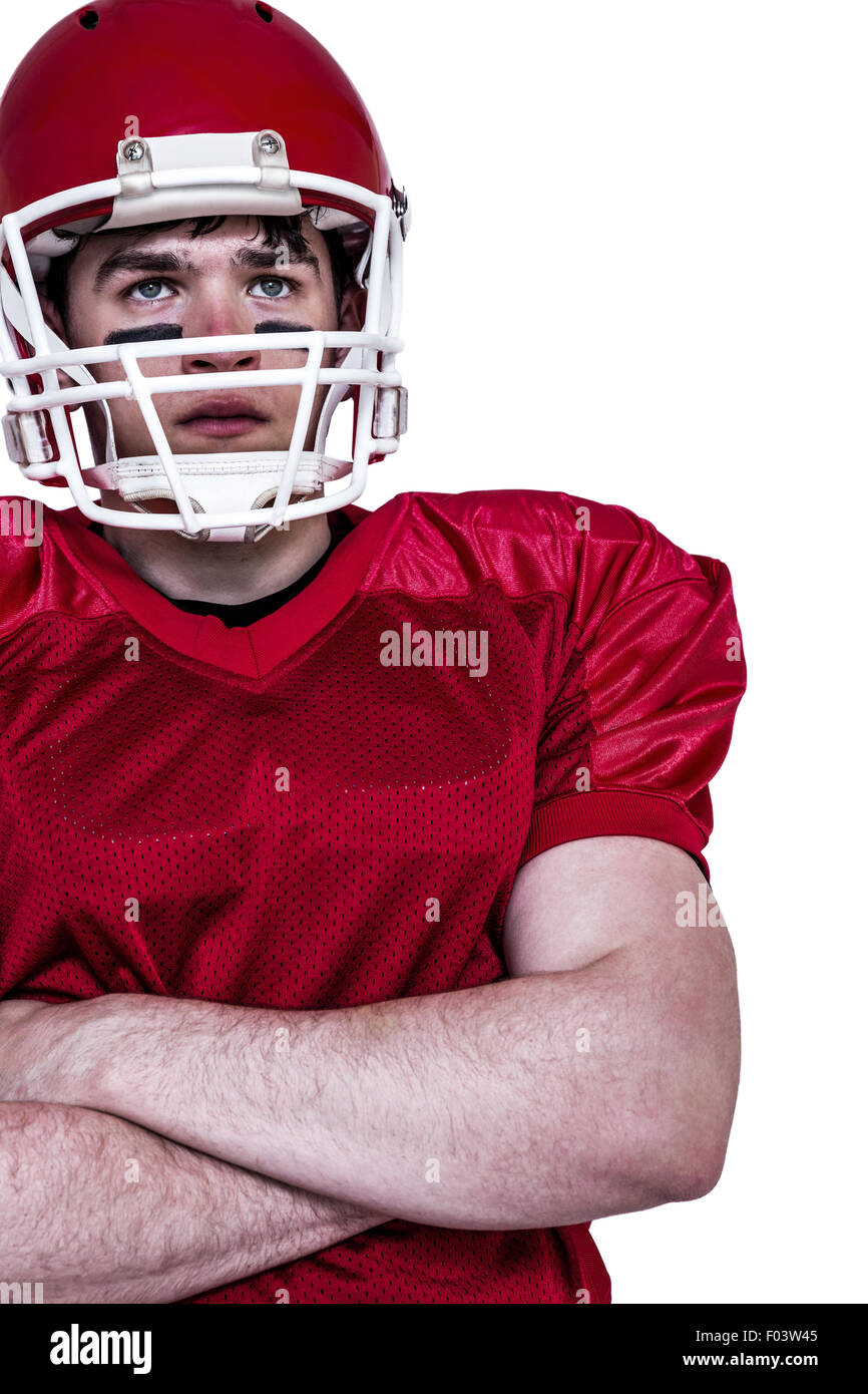 American football player with arms crossed Stock Photo - Alamy