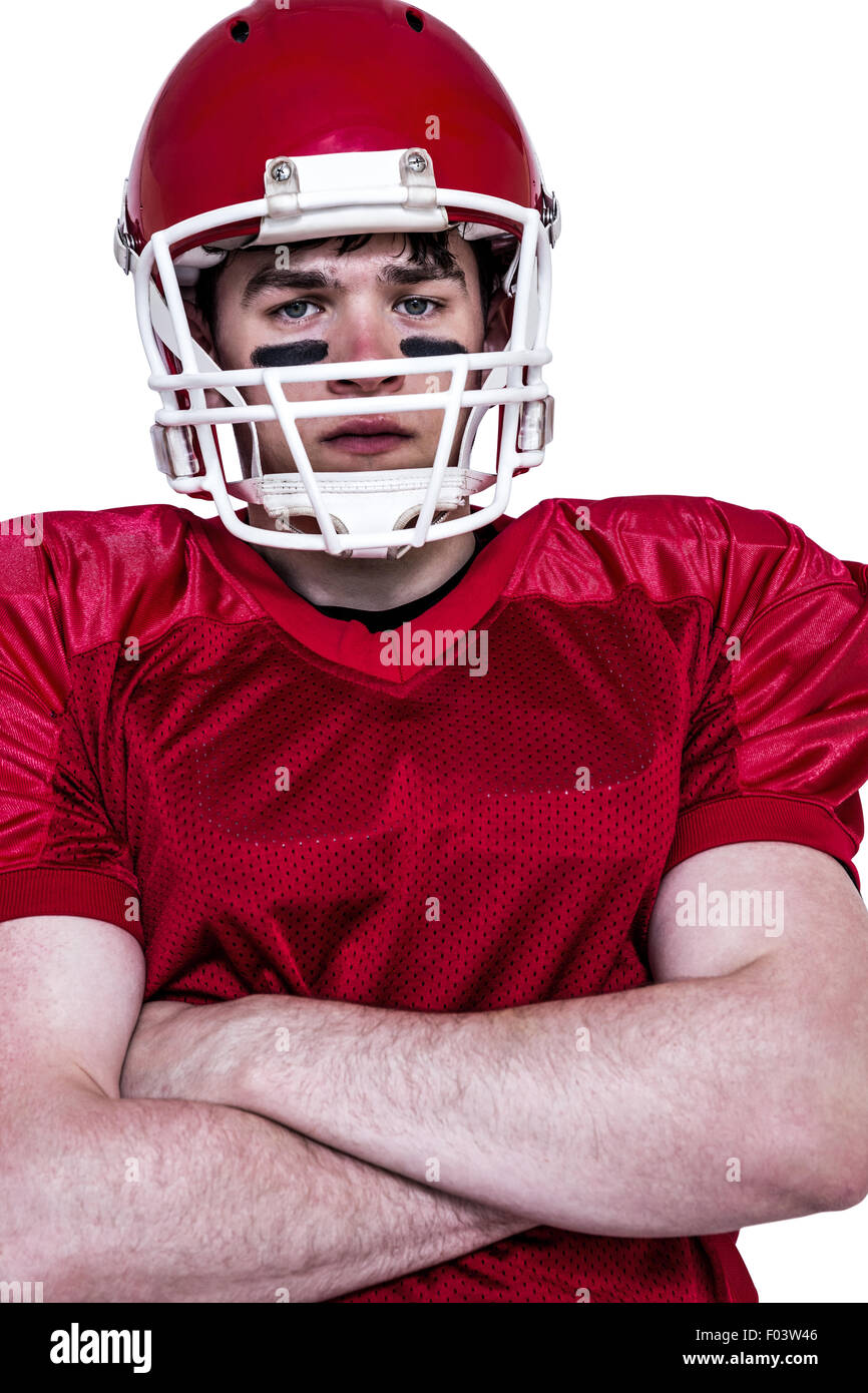 American football player with arms crossed Stock Photo - Alamy