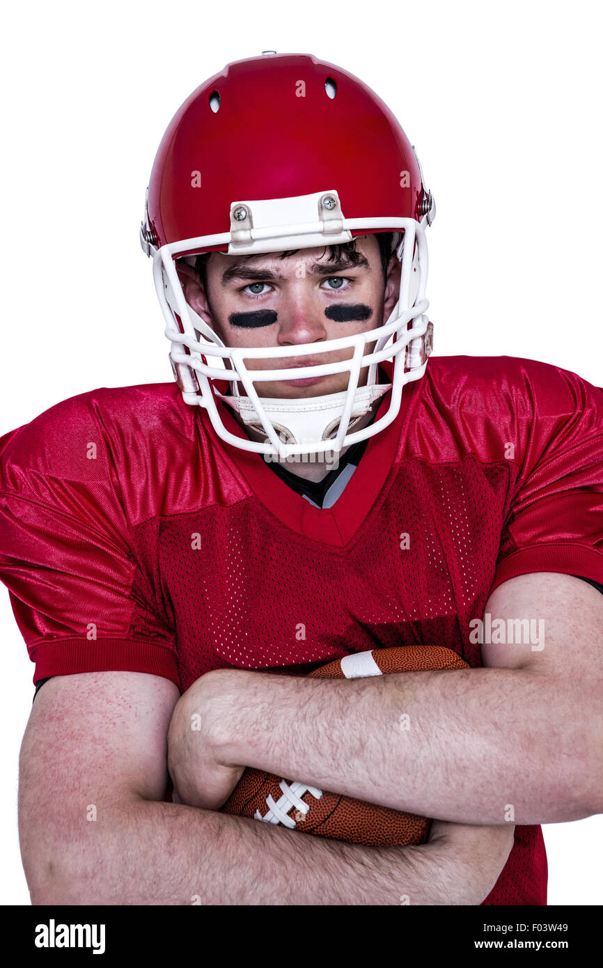 American football player with arms crossed Stock Photo - Alamy