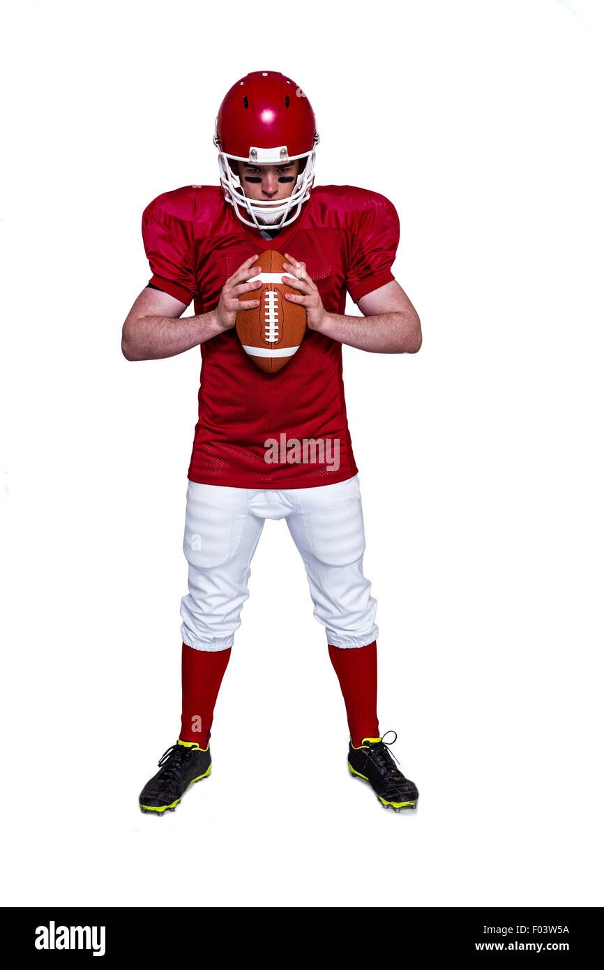 Quarterback holding ball Cut Out Stock Images & Pictures - Alamy