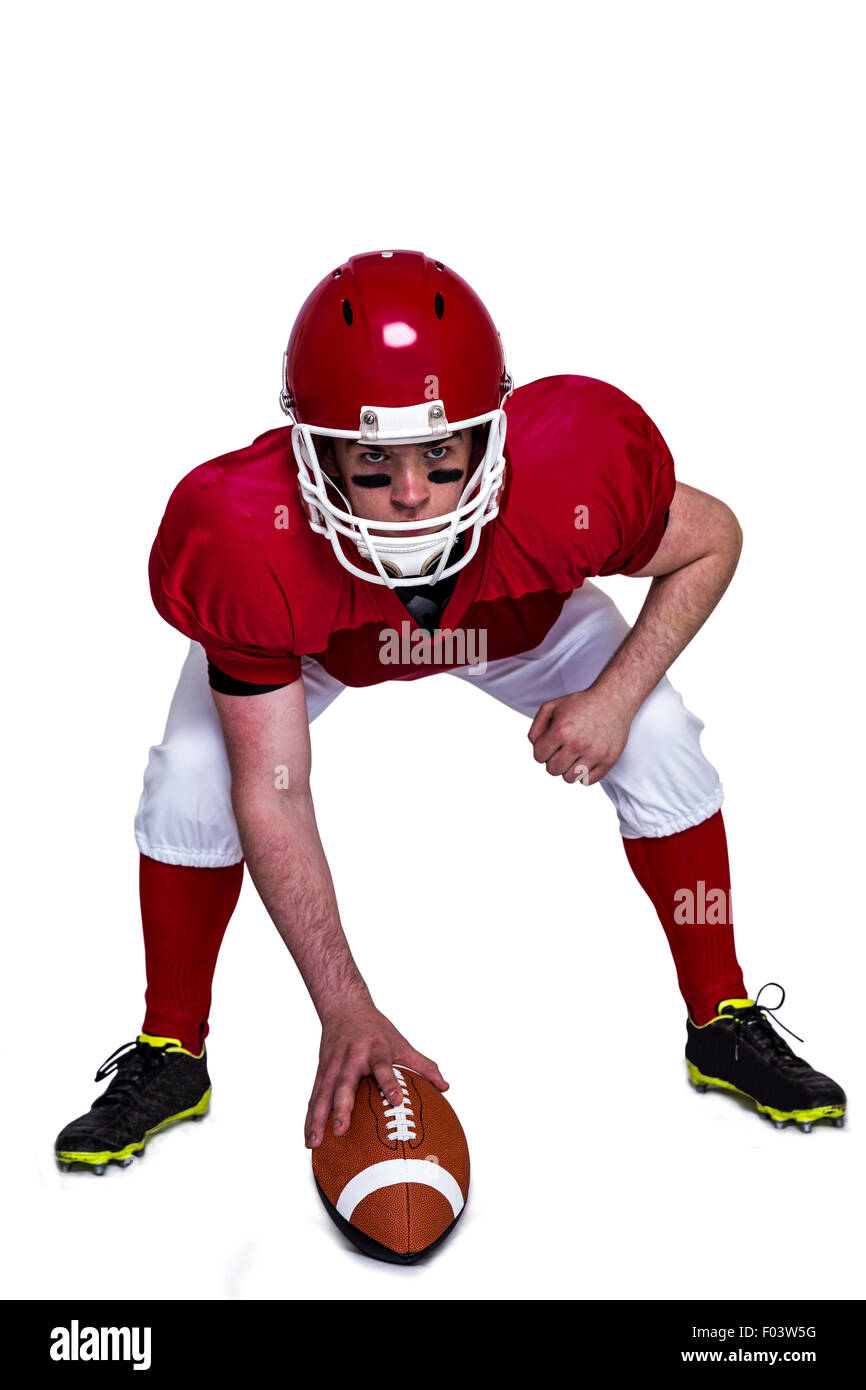 American football player in attack stance Stock Photo - Alamy