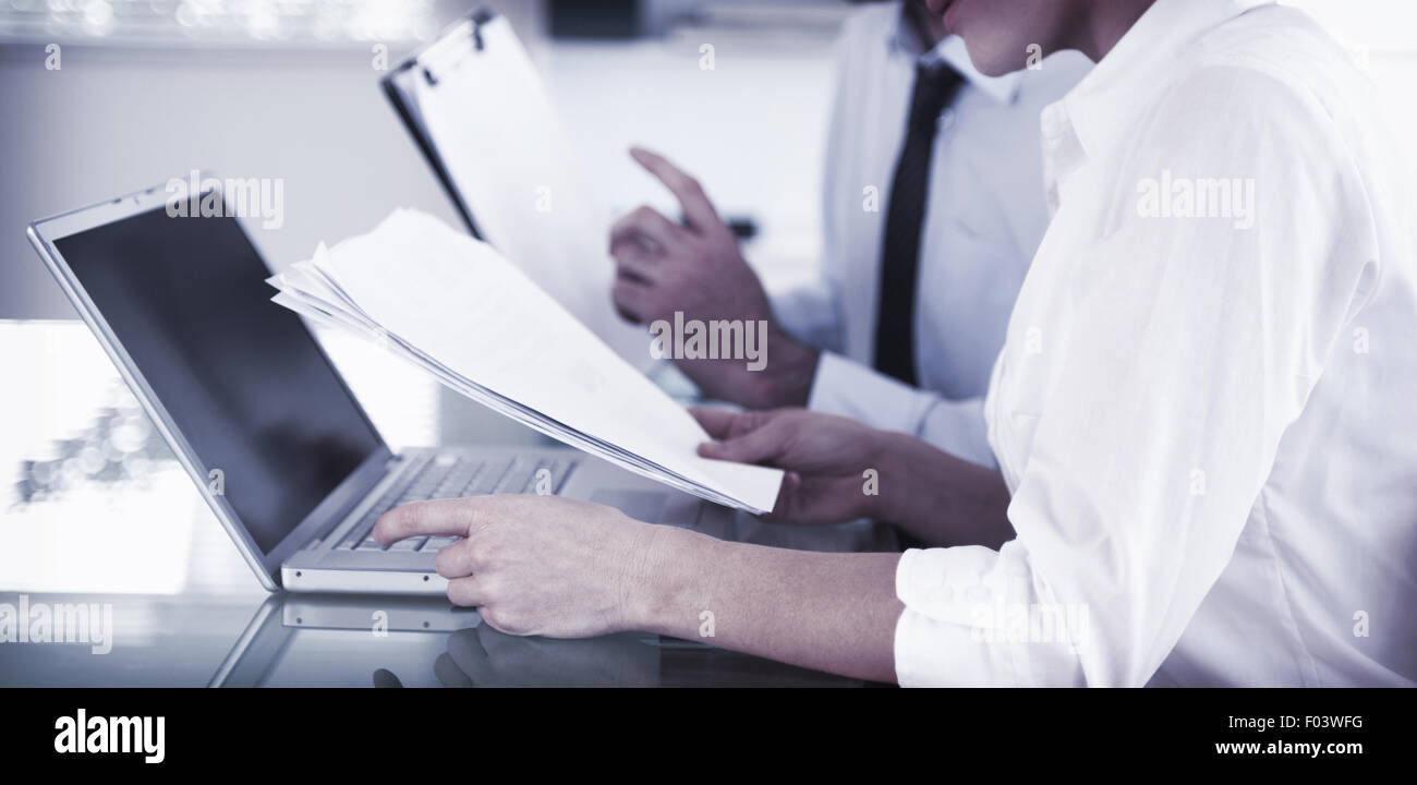 Office workers typing a report from blueprint documents Stock Photo - Alamy