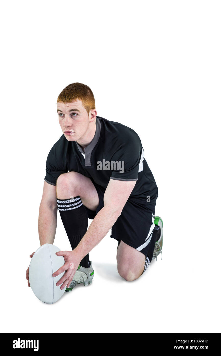 Rugby player ready to make a drop kick Stock Photo - Alamy