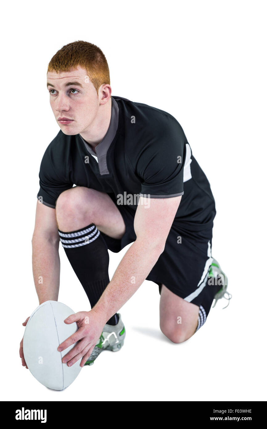 Rugby player ready to make a drop kick Stock Photo - Alamy