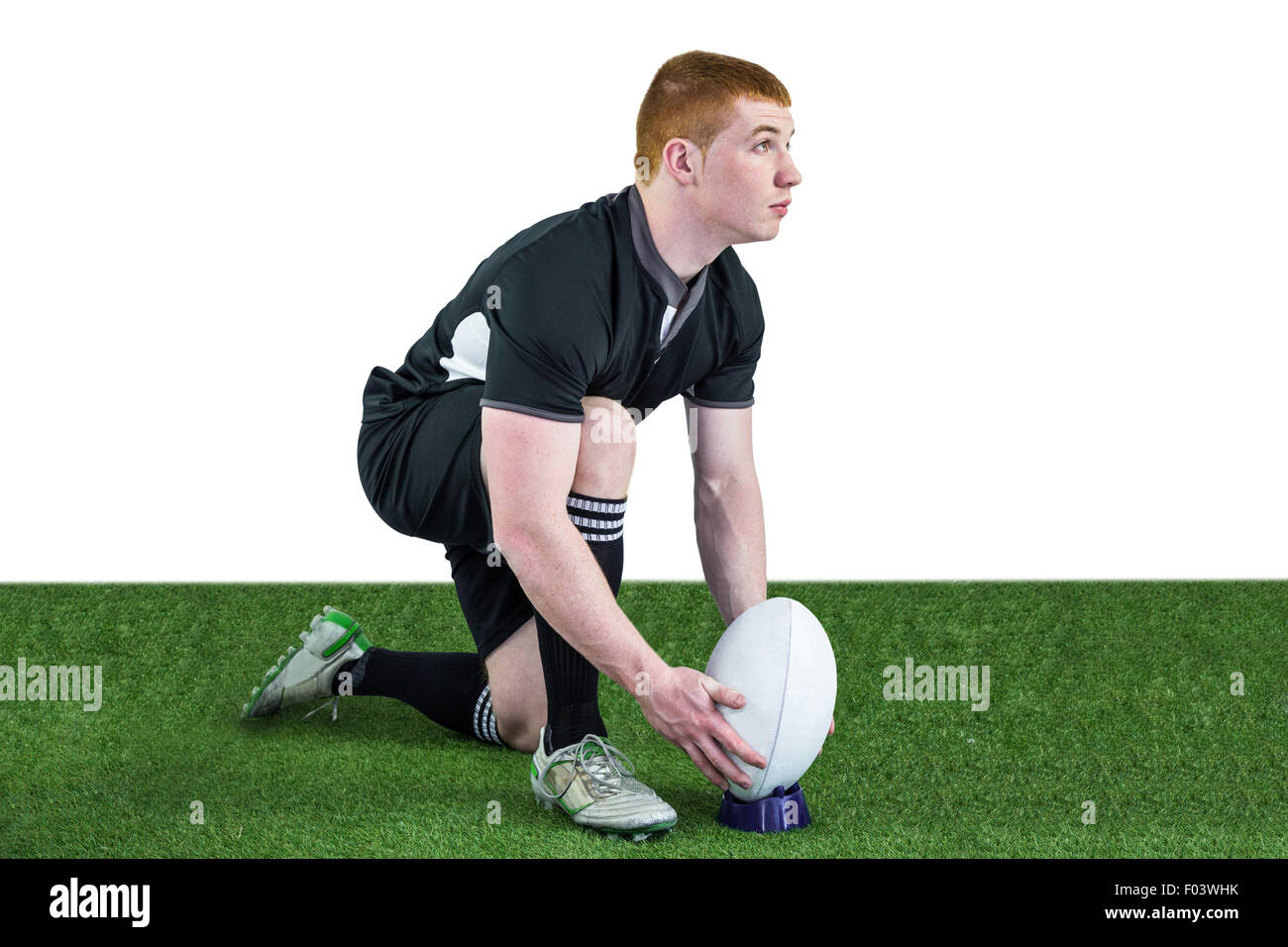 Rugby player ready to make a drop kick Stock Photo - Alamy