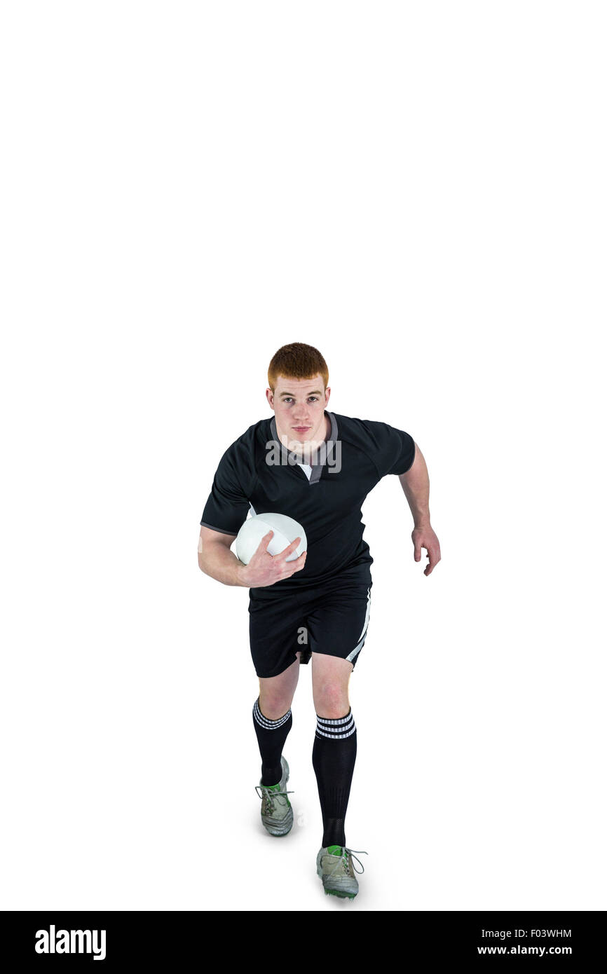Rugby player running with a rugby ball Stock Photo - Alamy