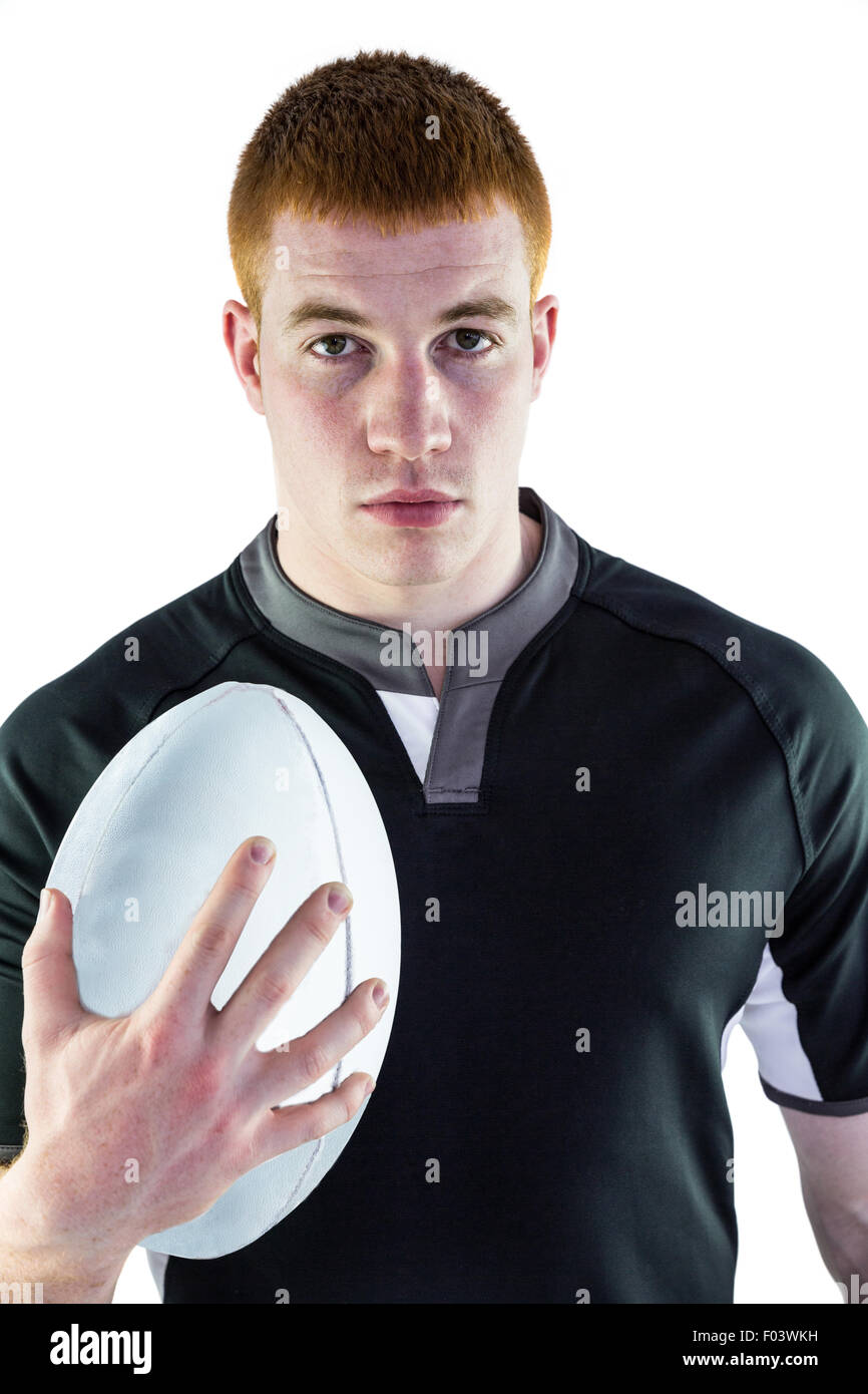 Rugby player holding a rugby ball Stock Photo - Alamy