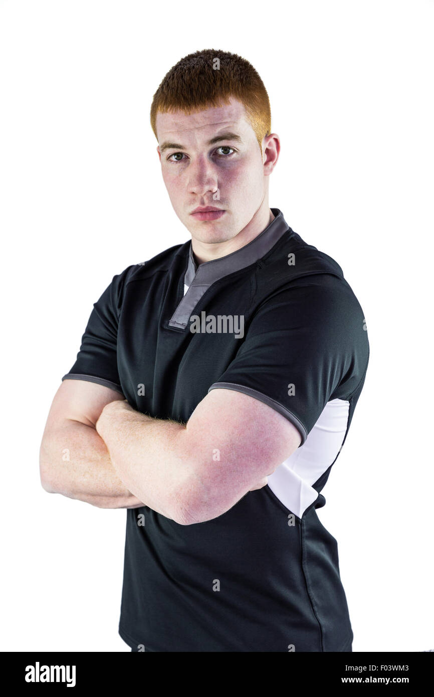 Rugby player with arms crossed Stock Photo - Alamy