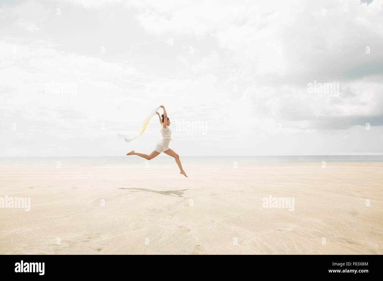 Leaping woman hi-res stock photography and images - Alamy