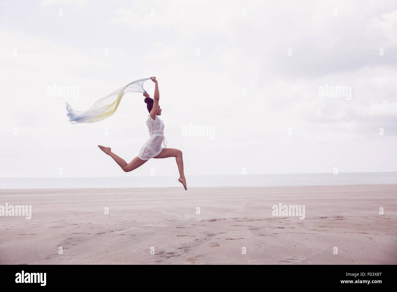 Leaping woman hi-res stock photography and images - Alamy