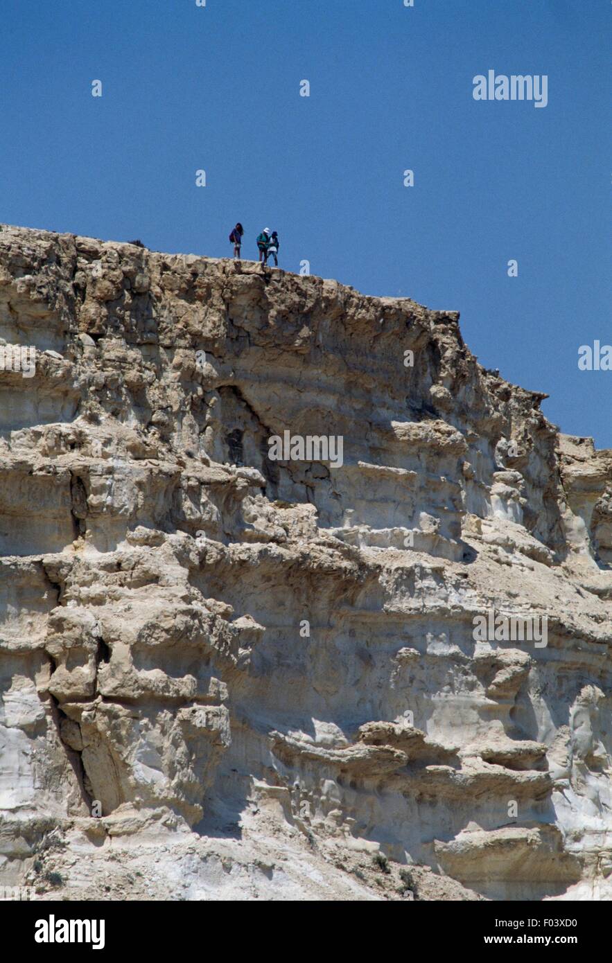 Tourists on the edge of the Ein Avdat canyon in Nahal Zin, Negev Desert ...