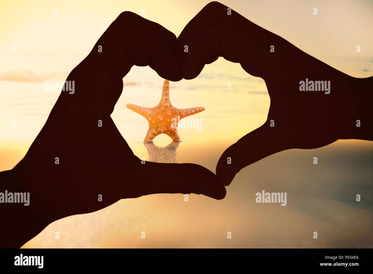Couple making heart shape hands hi-res stock photography and images - Alamy
