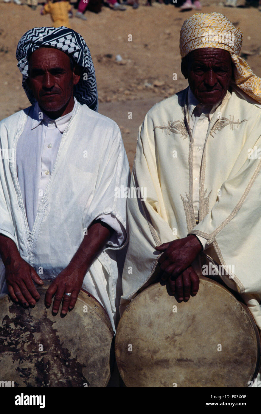 Men with bendirs in traditional dress, Matmata Berber festival, Tunisia ...