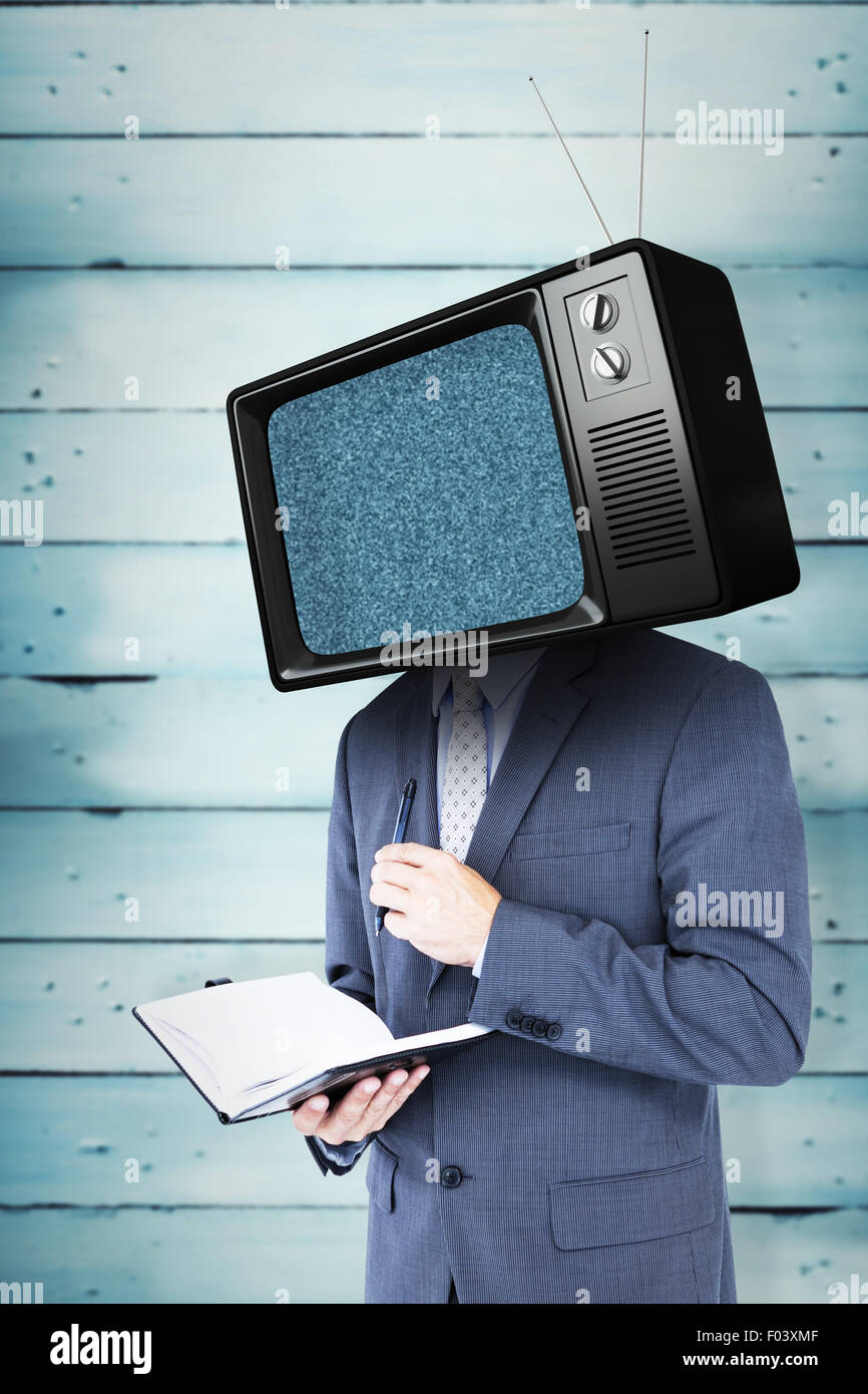 Composite image of anonymous businessman with diary Stock Photo - Alamy