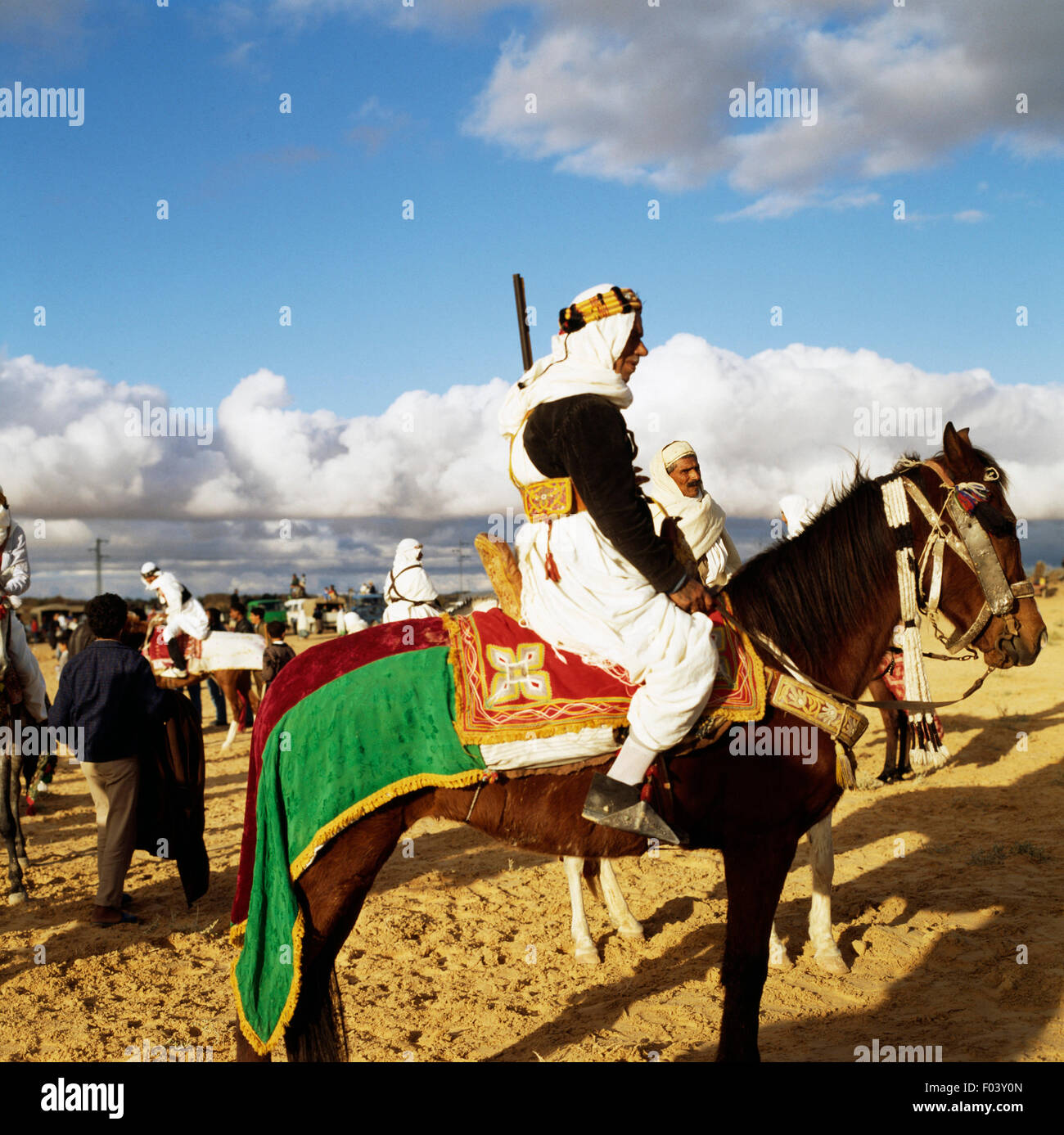 Berber horseman with rifle, Berber festival, Douz, Tunisia Stock Photo ...