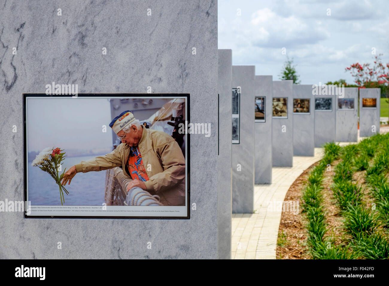 A photograph on a white marble plinth at the Patriot Plaza, Sarasota ...