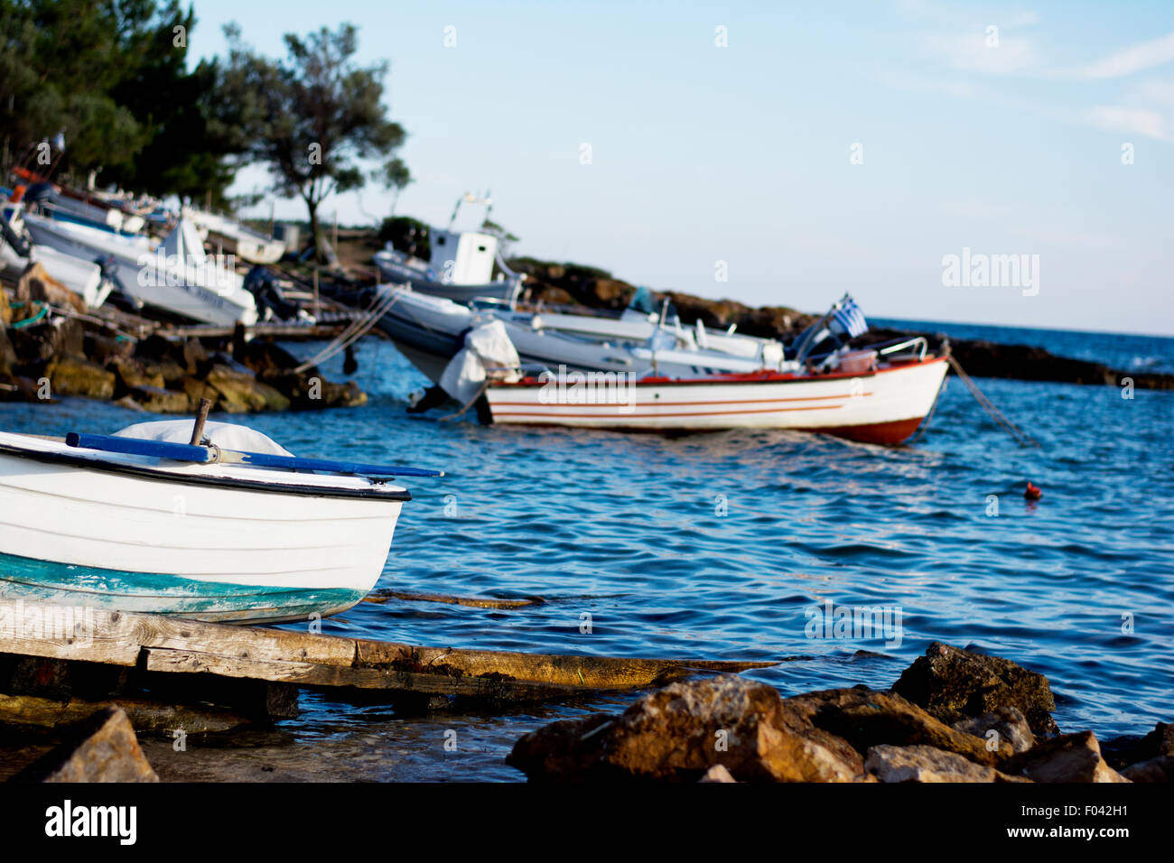 Colorful fishing boats in small marine in the sea Stock Photo - Alamy