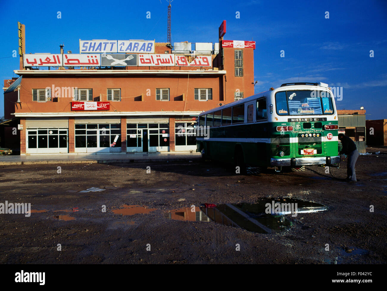 Bus in front of a building, Jordan, Iraq Stock Photo - Alamy