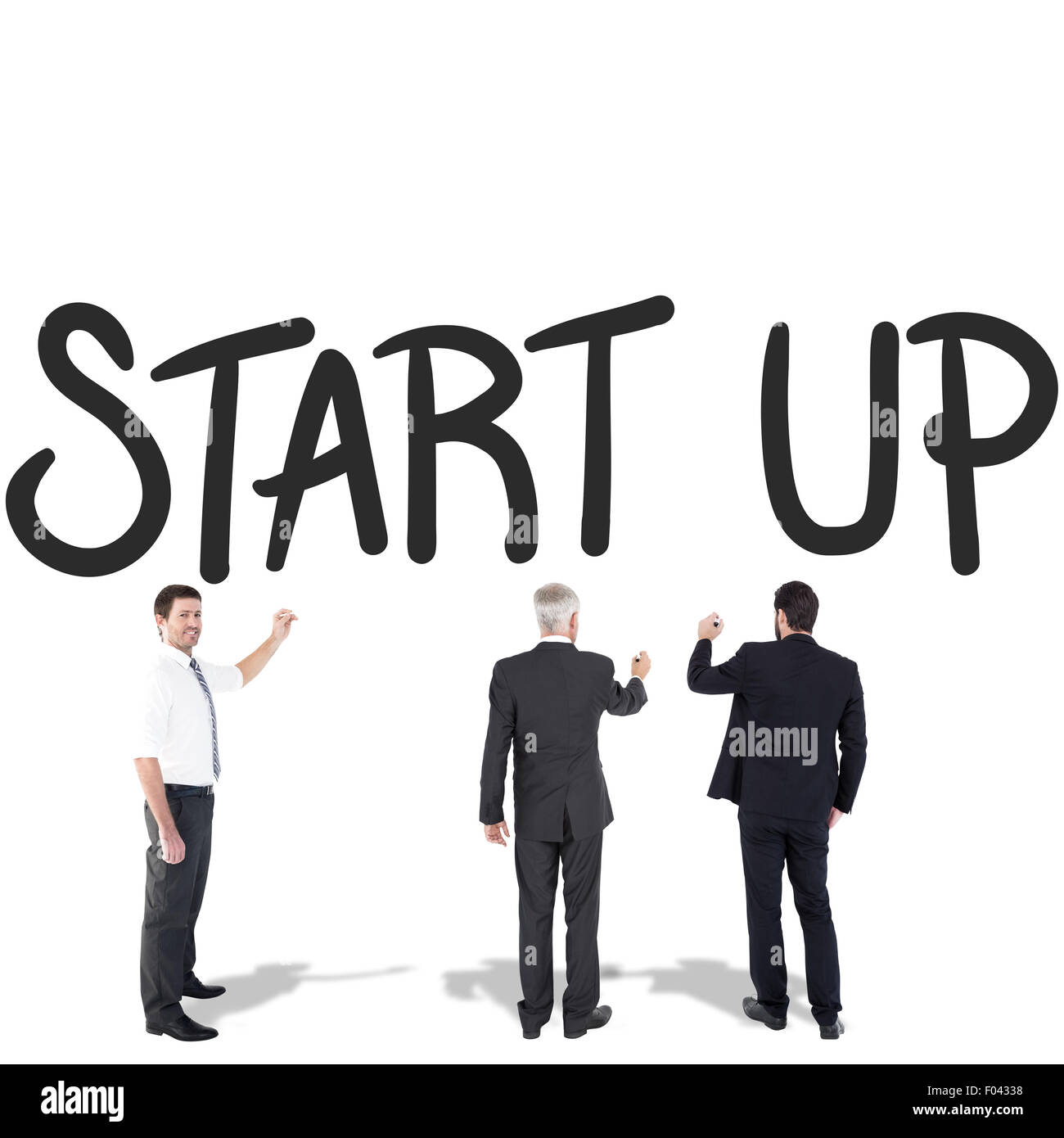Composite image of business team writing Stock Photo - Alamy
