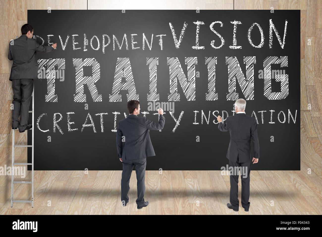 Composite image of business team writing Stock Photo - Alamy