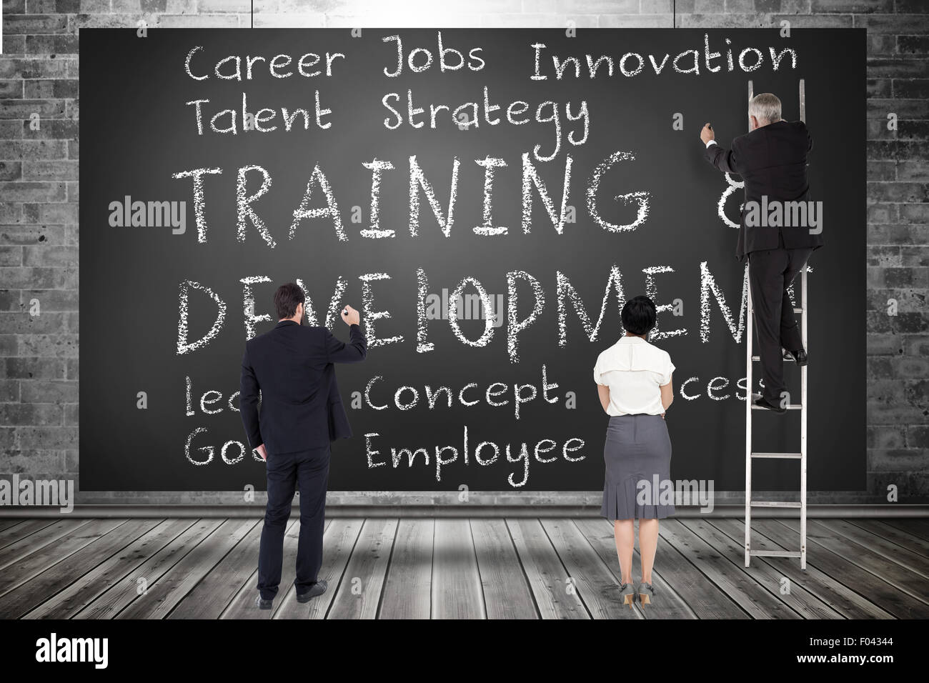 Composite image of business team writing Stock Photo - Alamy