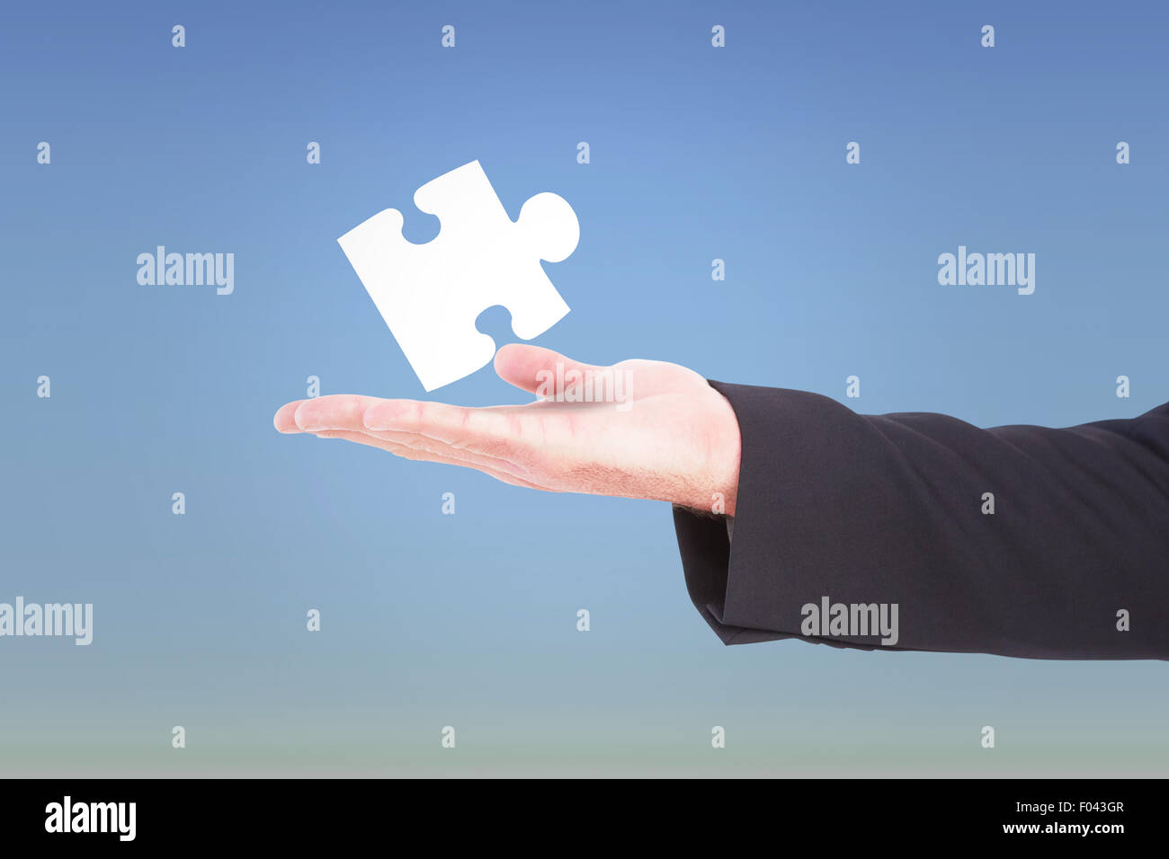 Composite image of businessman holding hand out in presentation Stock ...