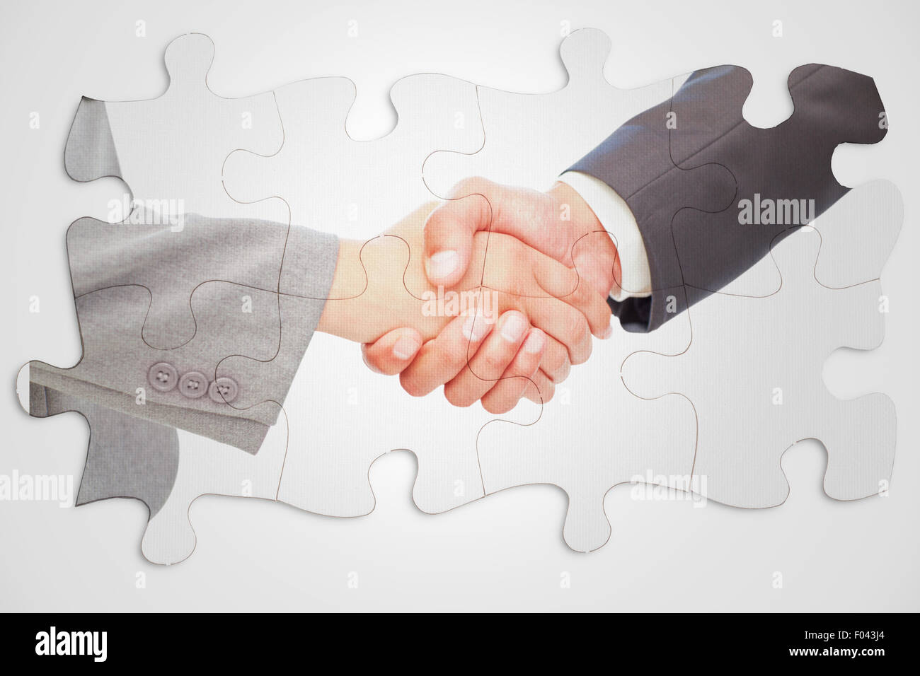 Composite image of handshake between two business people Stock Photo ...