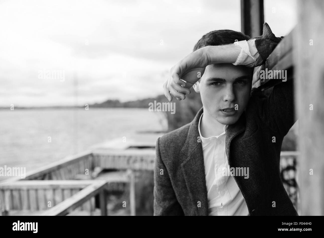 Man standing at lake Black and White Stock Photos & Images - Alamy