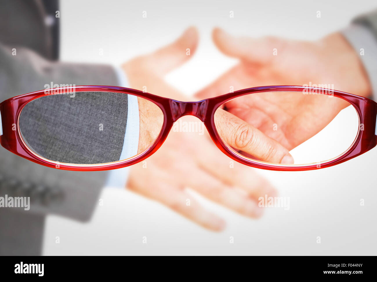 Composite image of two people going to shake their hands Stock Photo ...