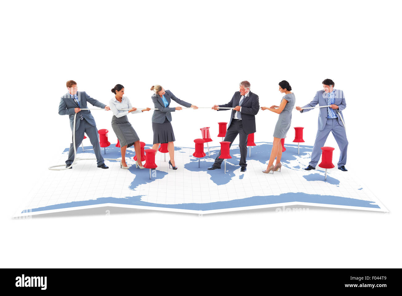 Composite image of business team pulling the rope Stock Photo - Alamy