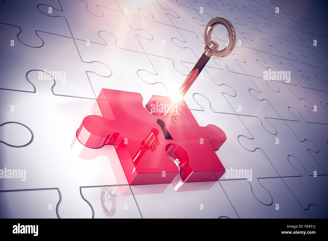 Key unlocking jigsaw Stock Photo - Alamy