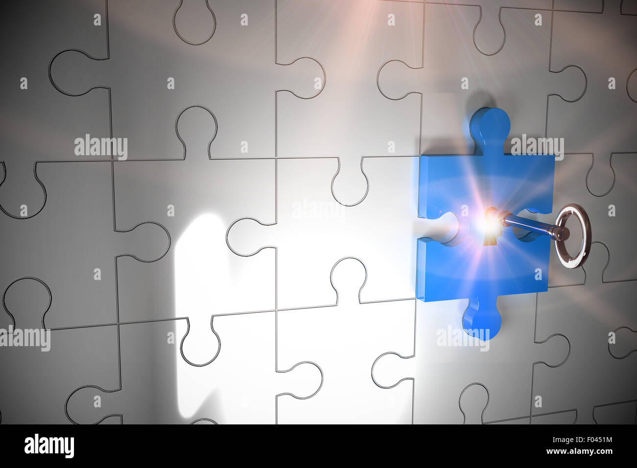 Key unlocking jigsaw Stock Photo - Alamy