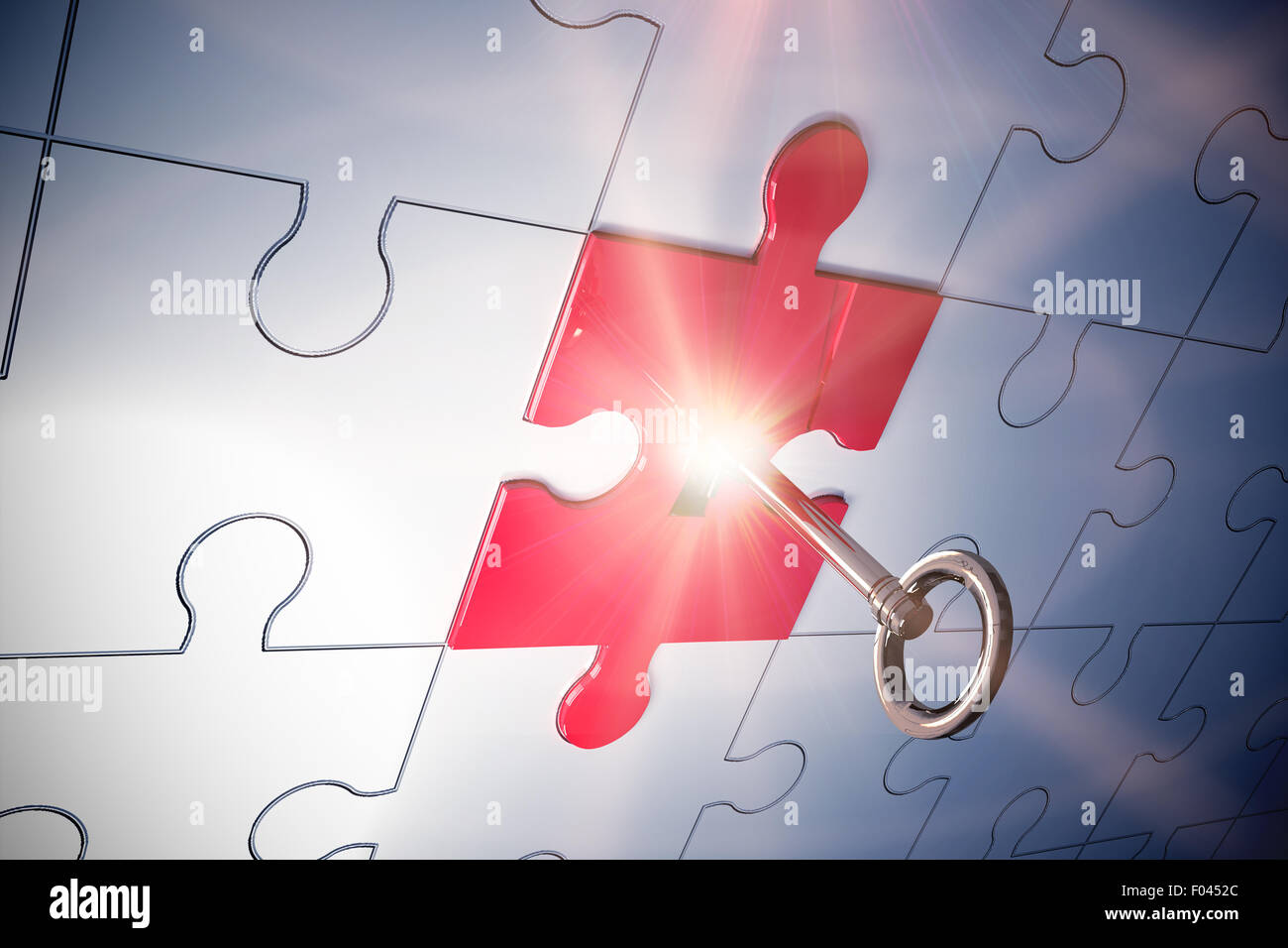 Key unlocking jigsaw Stock Photo - Alamy