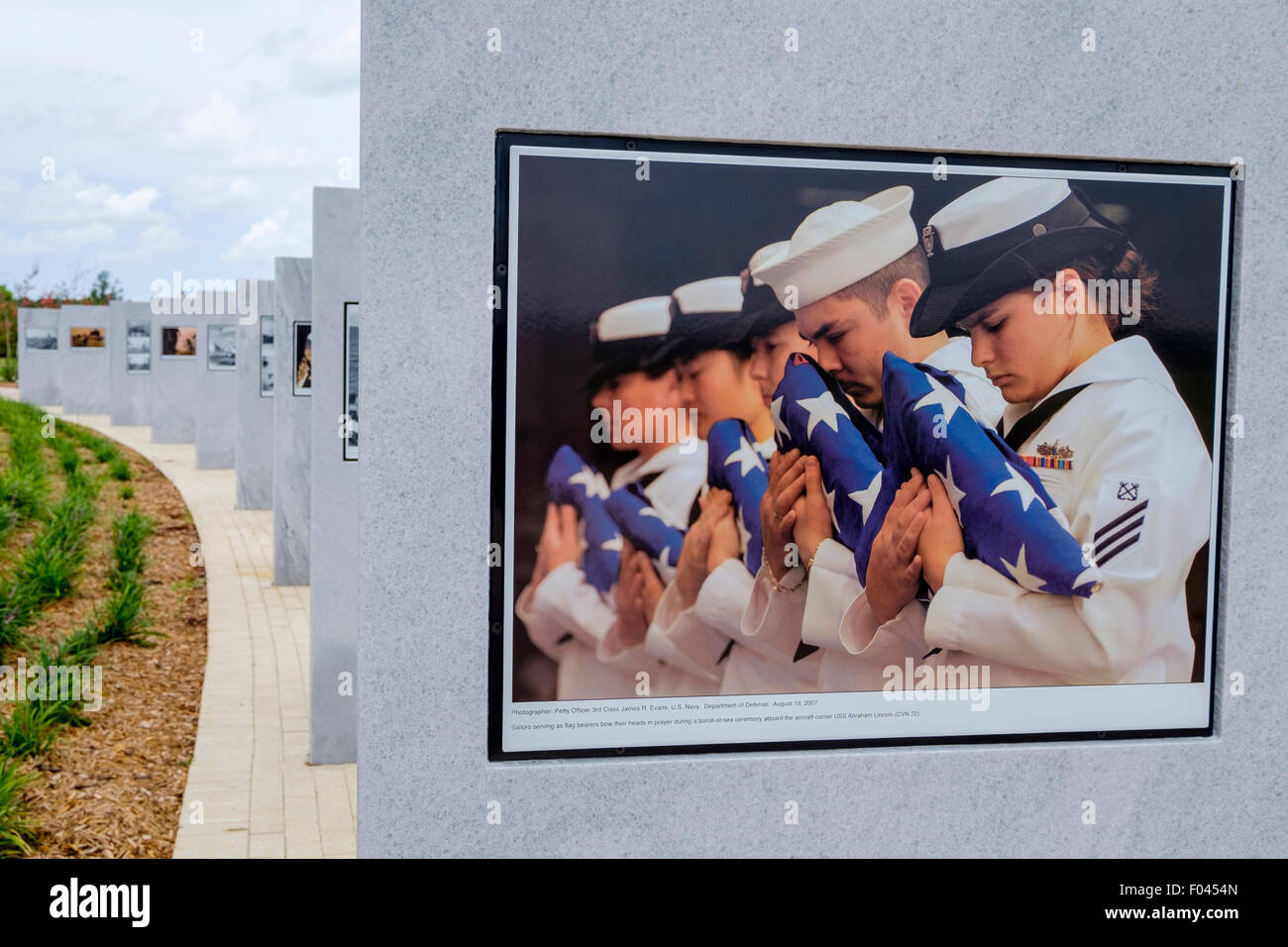 A photograph on a white marble plinth at the Patriot Plaza, Sarasota ...