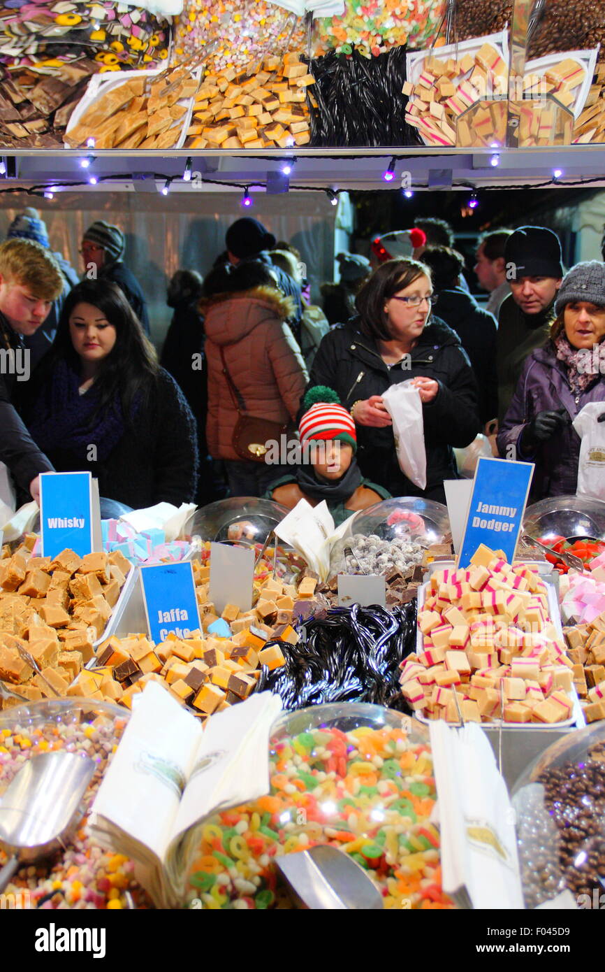 People peruse sweet treats on a confectionery stall at Lincoln ...