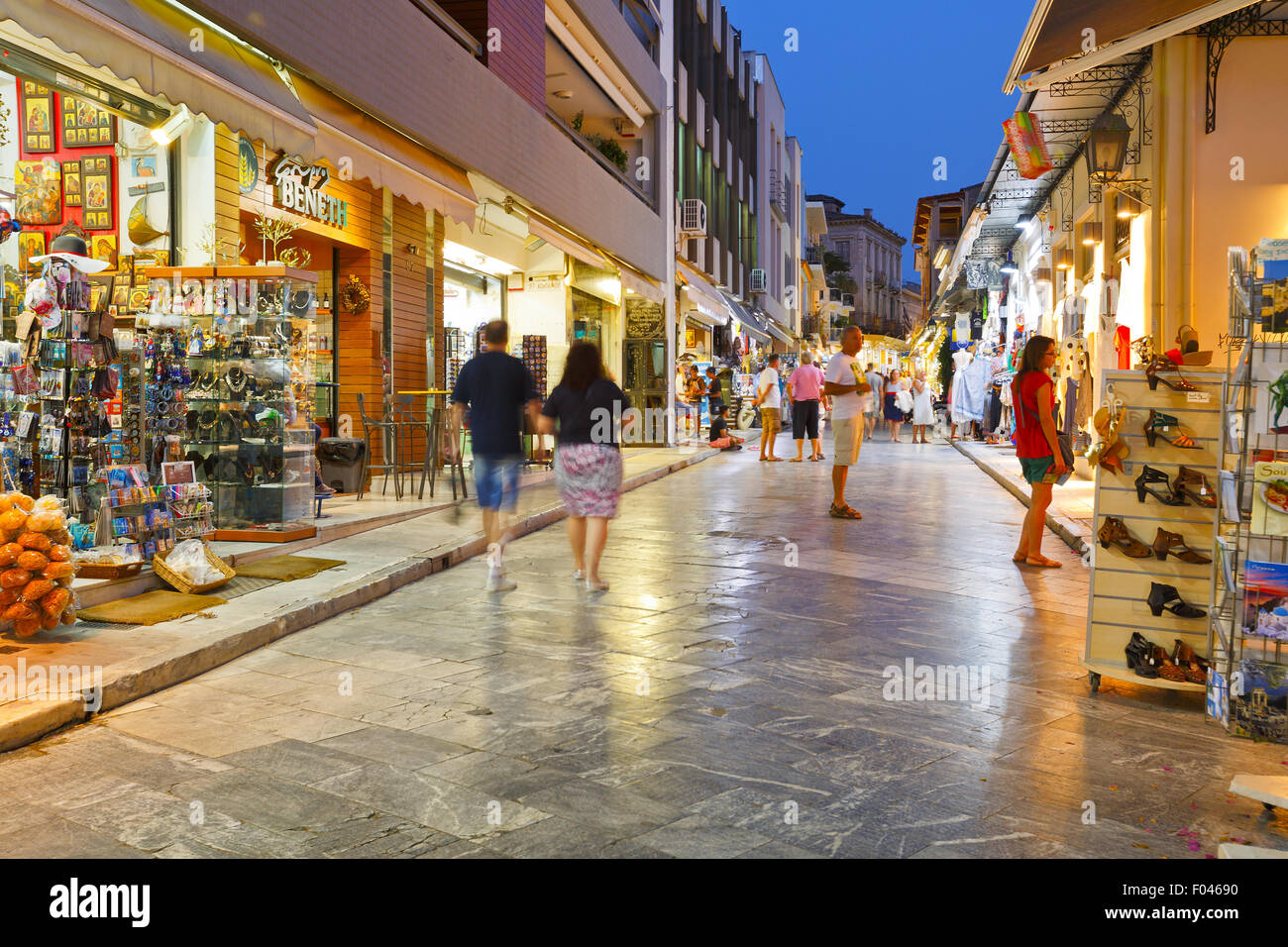 People in the main shopping street of the old town of Plaka in Athens ...