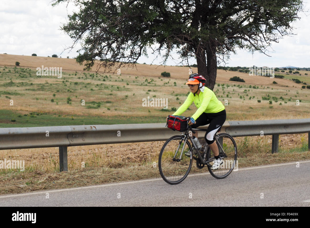 Female tourist riding bike hi-res stock photography and images - Alamy