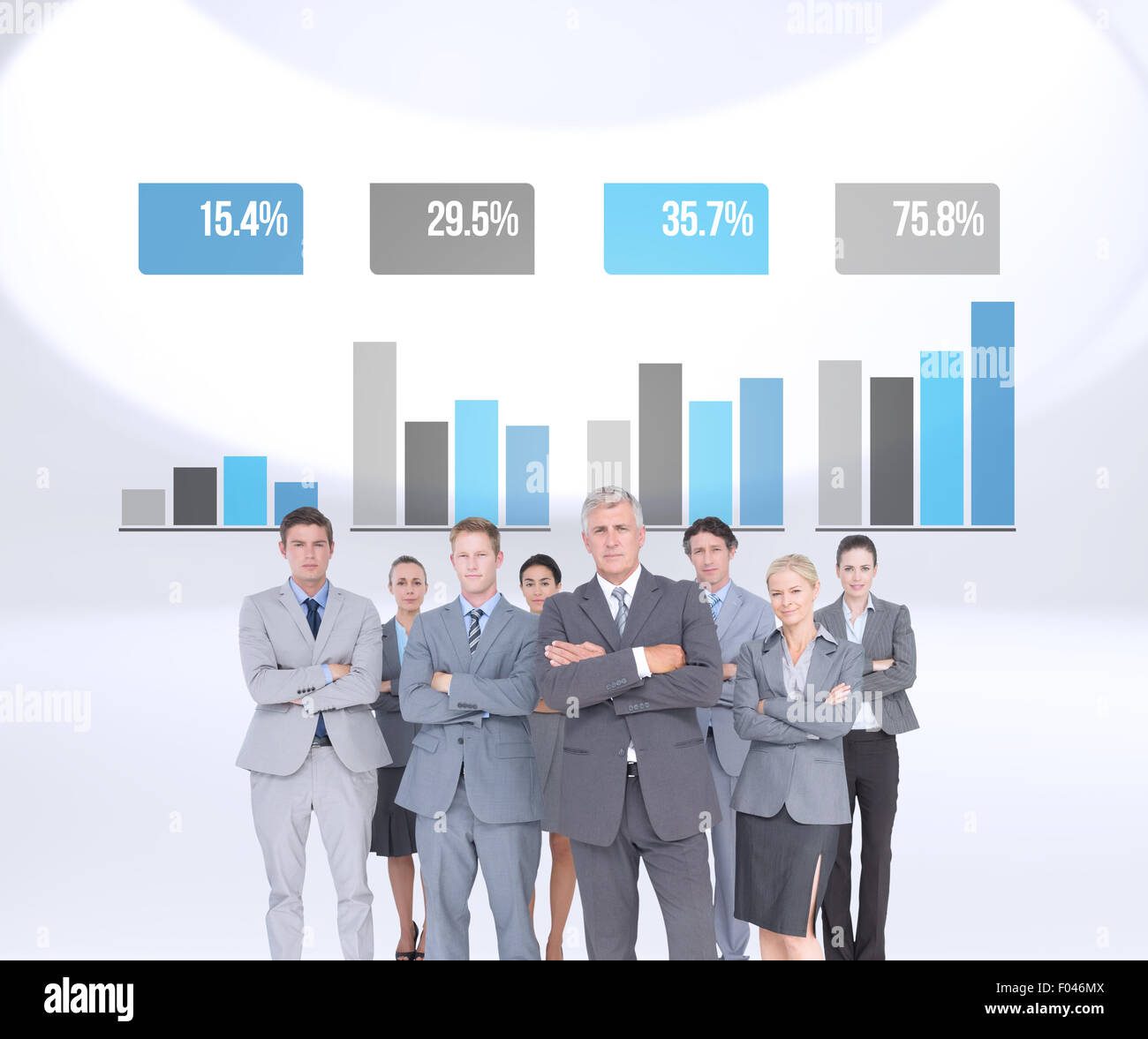 Composite image of business team standing arms crossed Stock Photo - Alamy