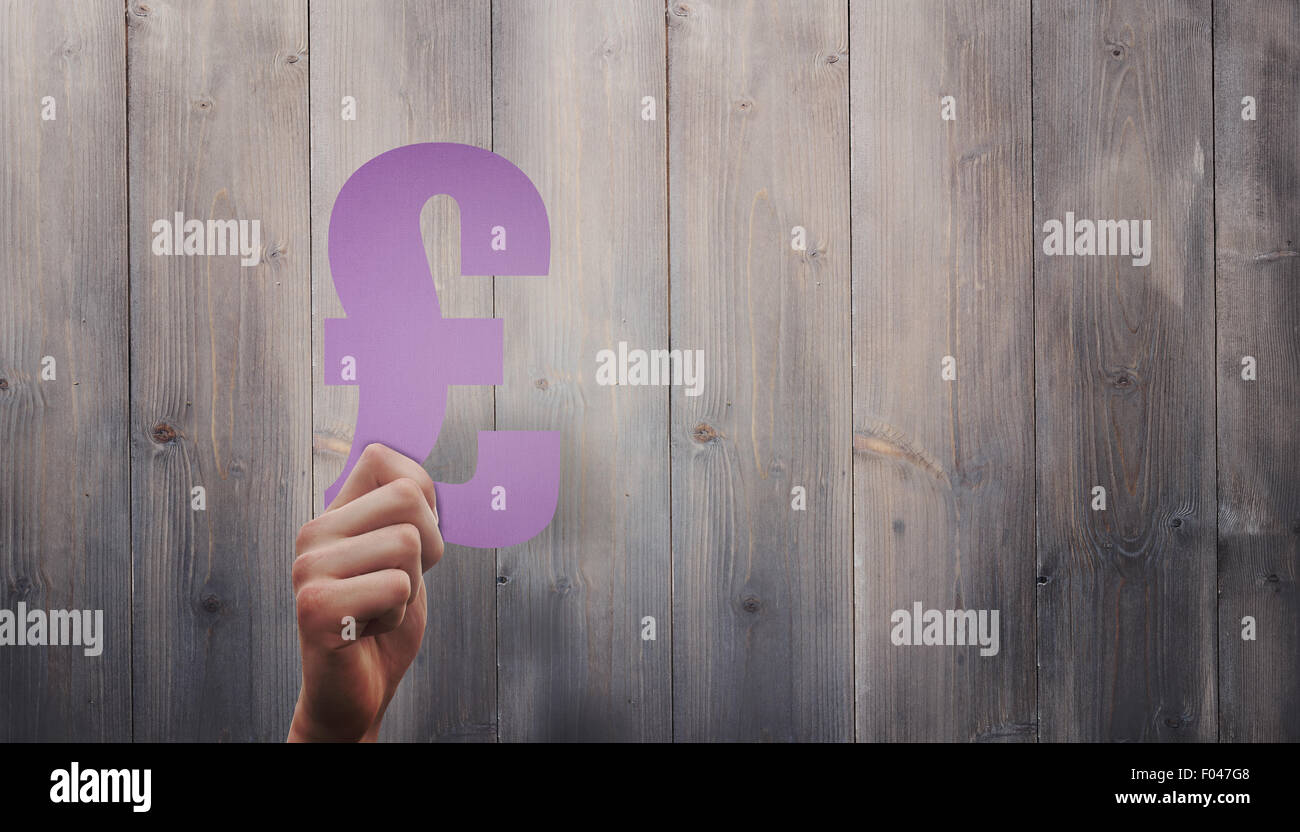 Composite image of hand holding pound sign Stock Photo - Alamy