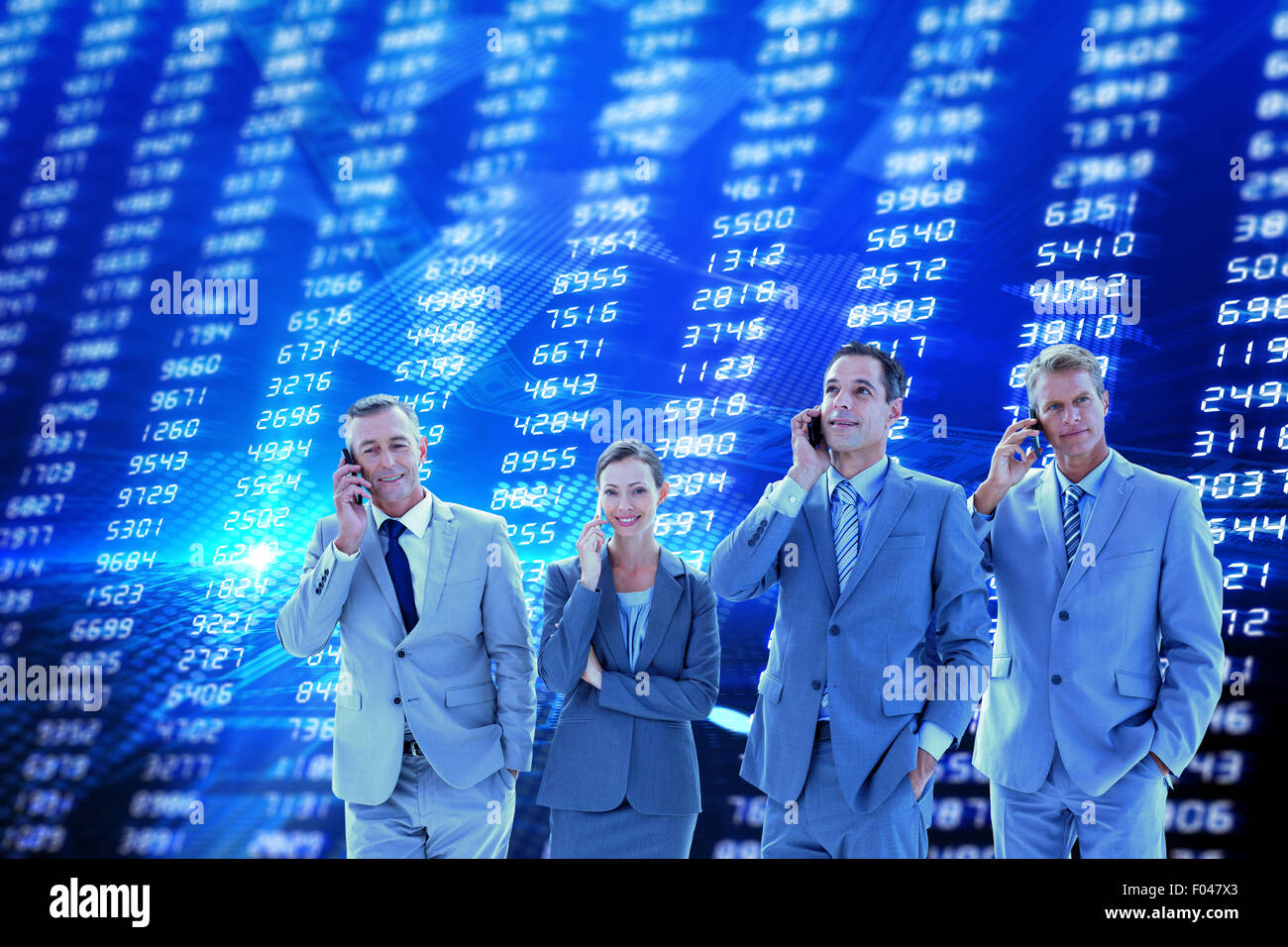 Composite image of employees using their mobile phone Stock Photo - Alamy