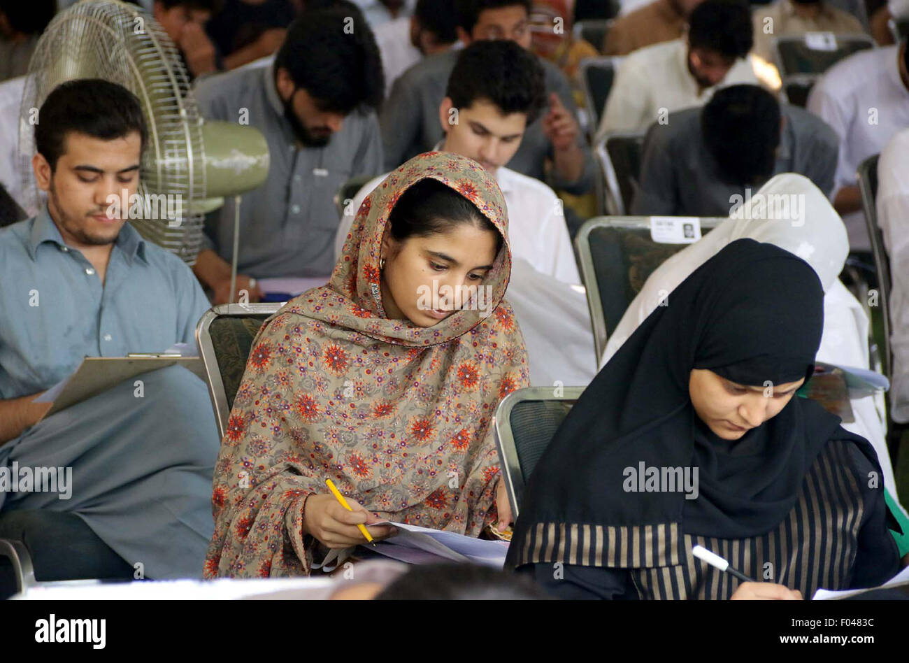 Students are busy in solving their question paper during aptitude test ...