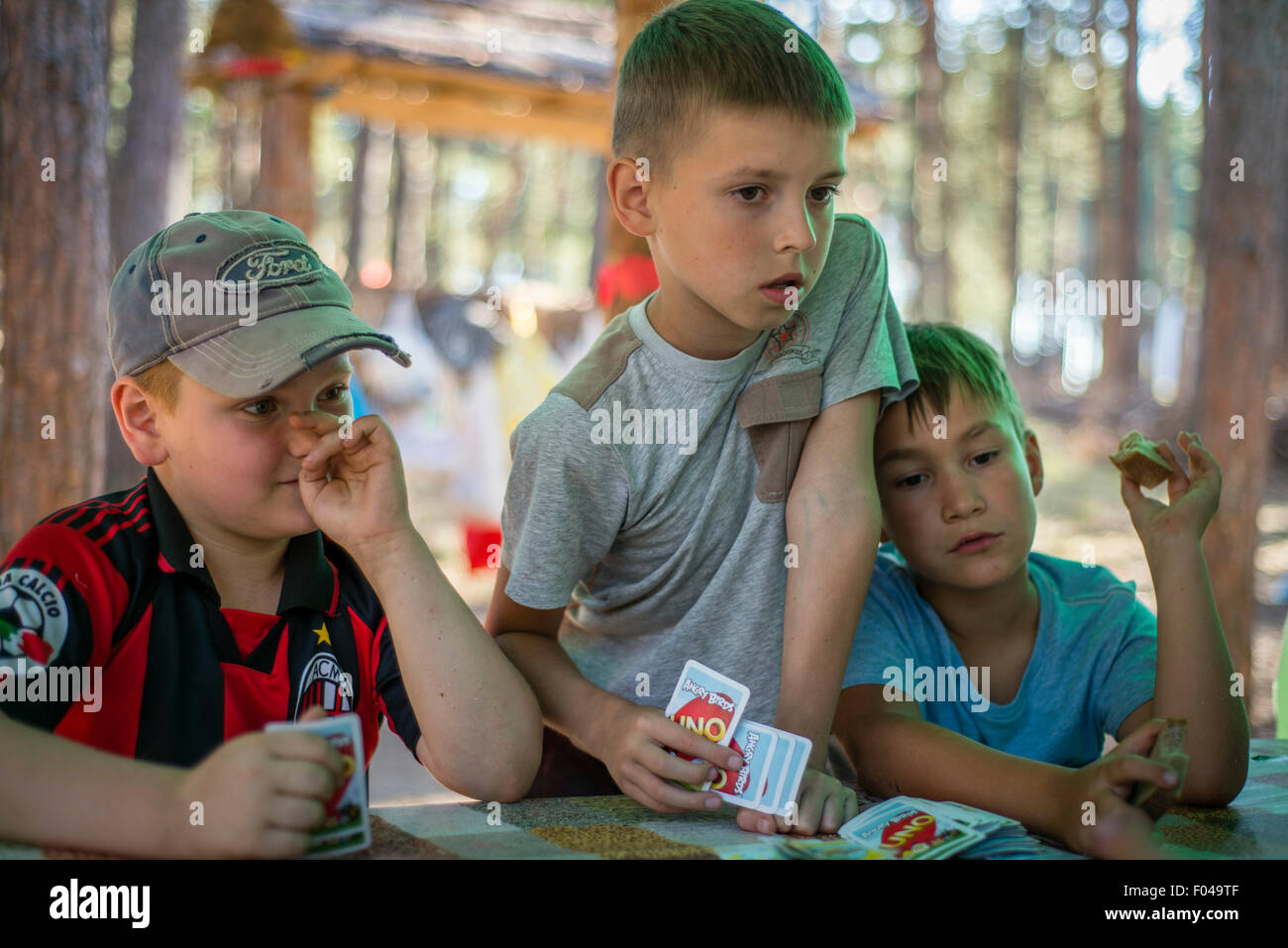Boy scouts playing board game in Ukrainian scout training camp, Kiev ...