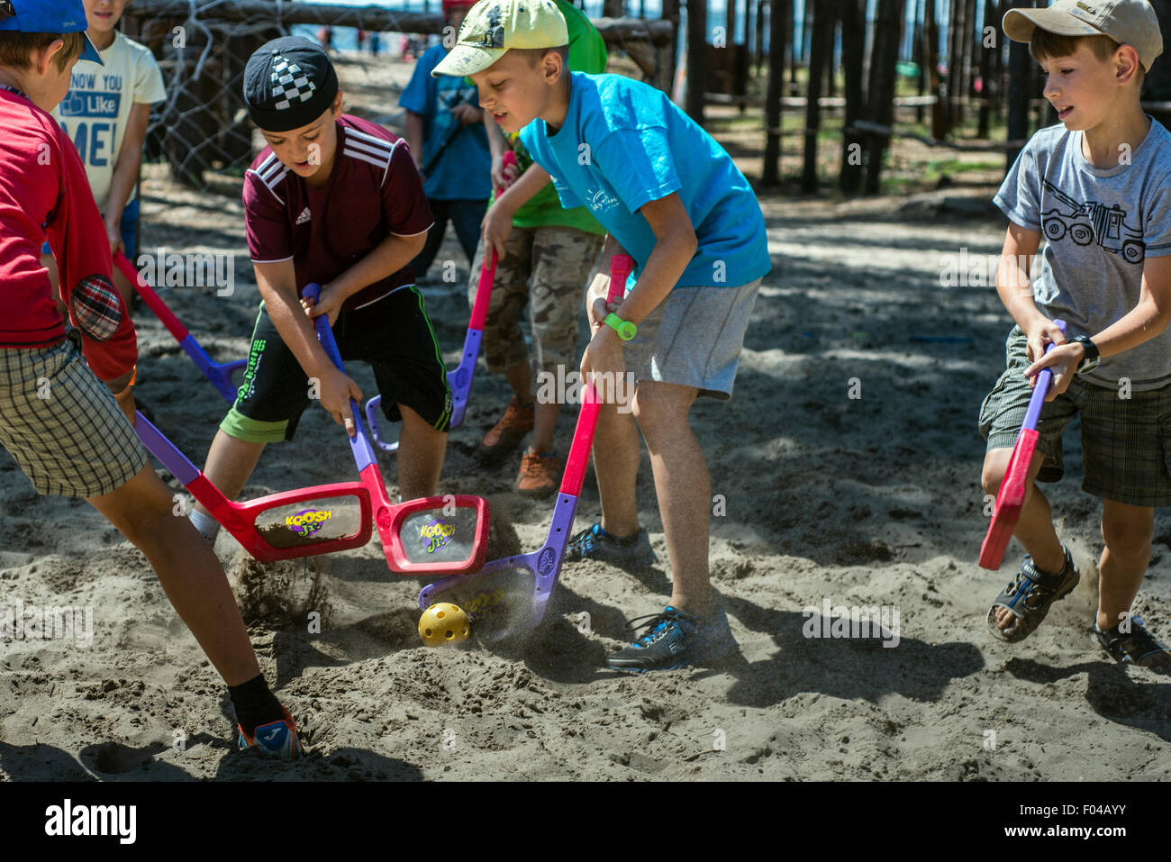 Boy scouts playing floorball match in Ukrainian scout training camp ...