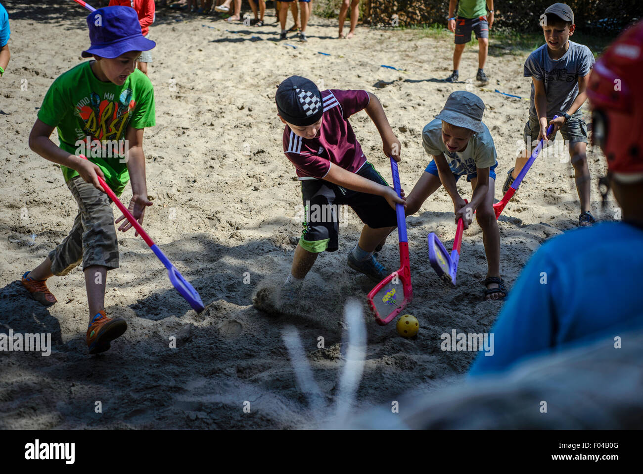 Boy scouts playing floorball match in Ukrainian scout training camp ...