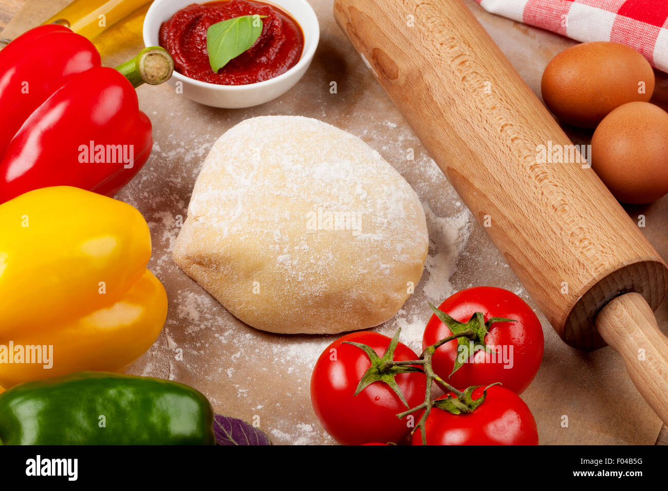 Pizza cooking ingredients. Dough, vegetables and spices Stock Photo - Alamy
