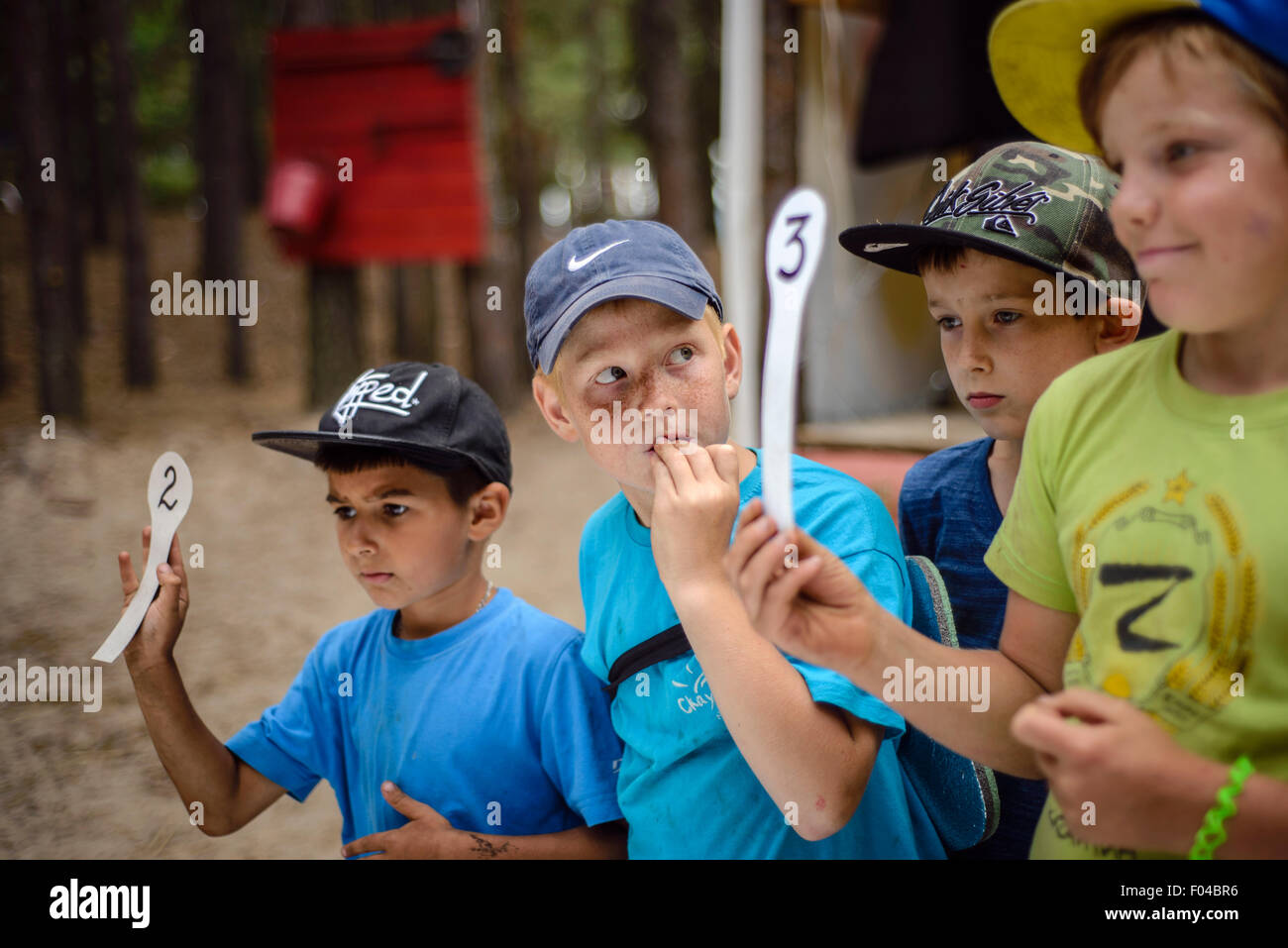 Boy scouts playing game on general erudition in Ukrainian scout ...