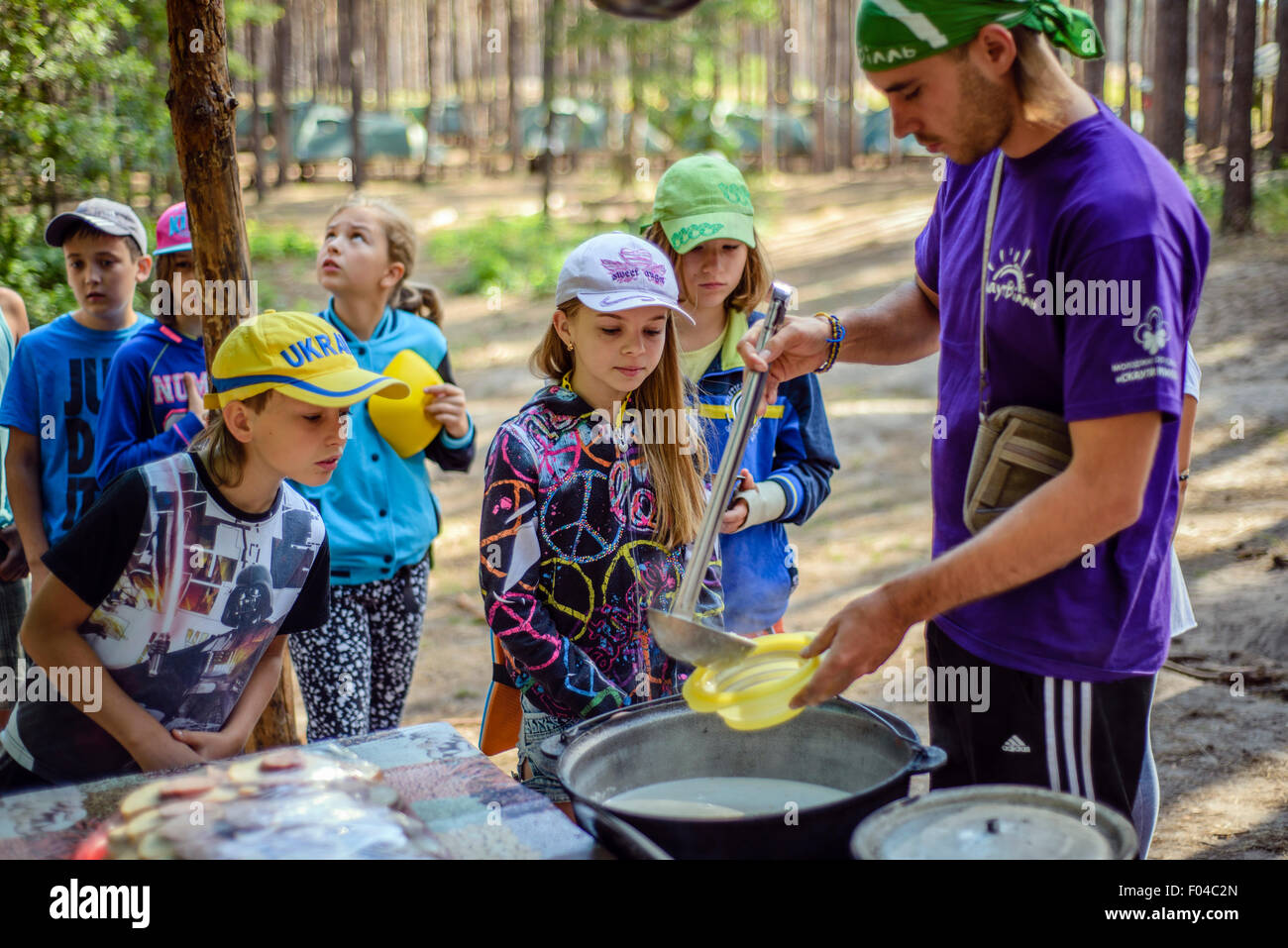 Scouts during lunch in Ukrainian scout training camp, Kiev region ...