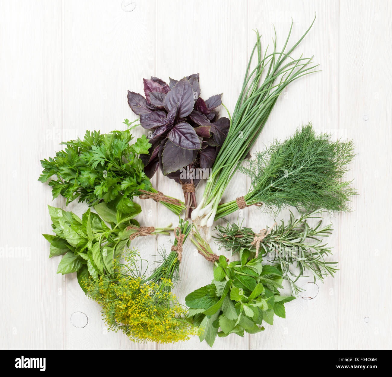 Fresh garden herbs on wooden table. Top view Stock Photo - Alamy