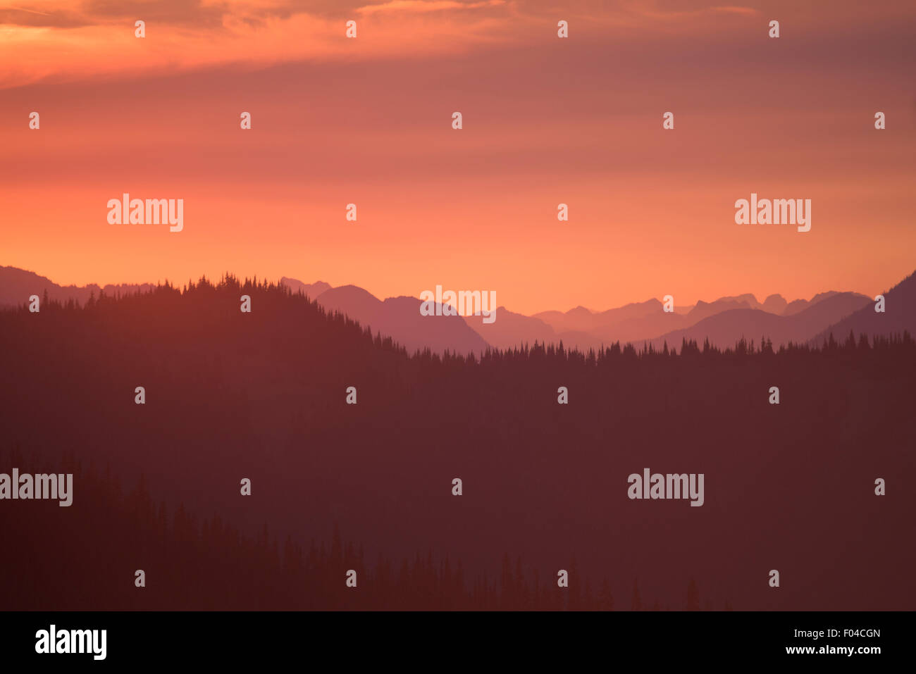 Evening post-sunset sky over mountains Stock Photo - Alamy