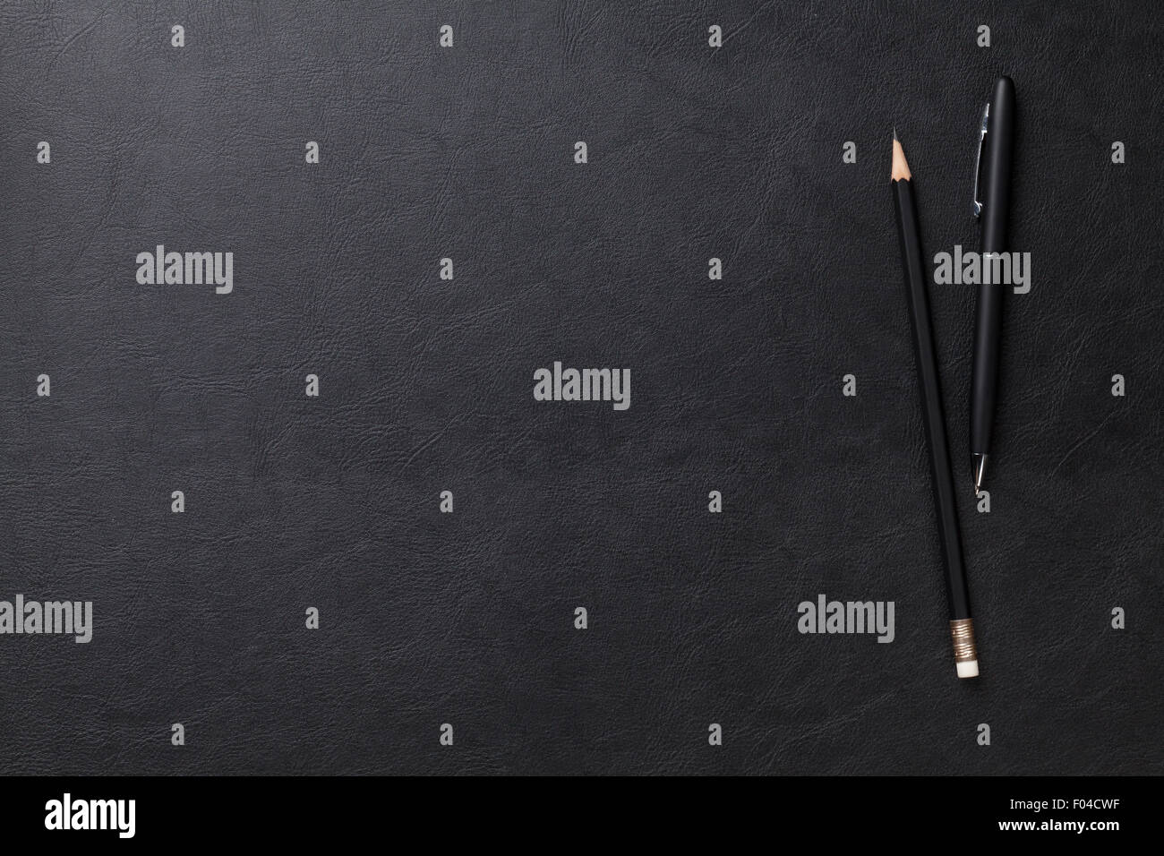 Office leather desk table with pen and pencil. Top view with copy space ...